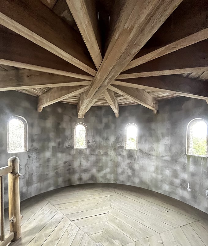 Look up! The wooden ceiling beams radiate like sunbeams, while narrow windows filter Florida's intense light into something almost sacred.
