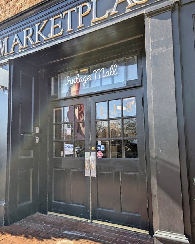The elegant glass doorway beckons downtown browsers into a vintage mall where Main Street charm meets timeless shopping pleasure.