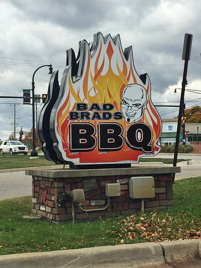 Bad Brads' flaming sign is impossible to miss – like a bat signal for BBQ enthusiasts cruising through Orion Township.