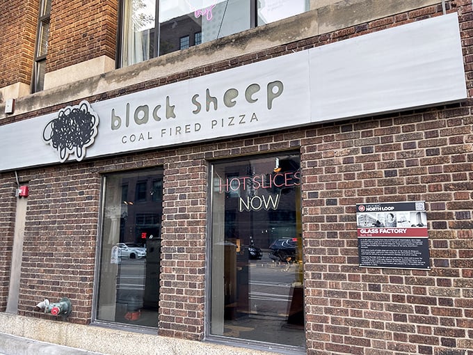 The understated brick exterior hides a pizza revolution – where coal-fired ovens transform simple ingredients into edible art.