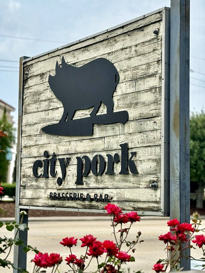 City Pork's black pig silhouette against weathered wood tells you everything – this place takes pork seriously in all its glorious forms.