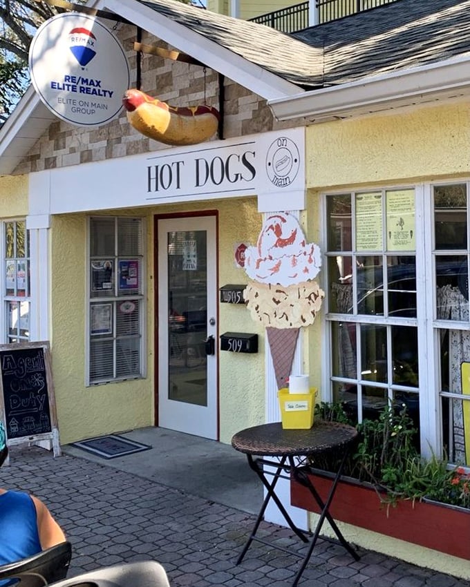 That giant hot dog hanging from the roof isn't false advertising – it's a delicious preview of the creative dogs waiting inside.