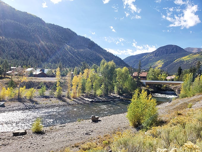 The river running through Lake City reflects golden aspens and mountain views – nature's mirror showing off Colorado's best angles.