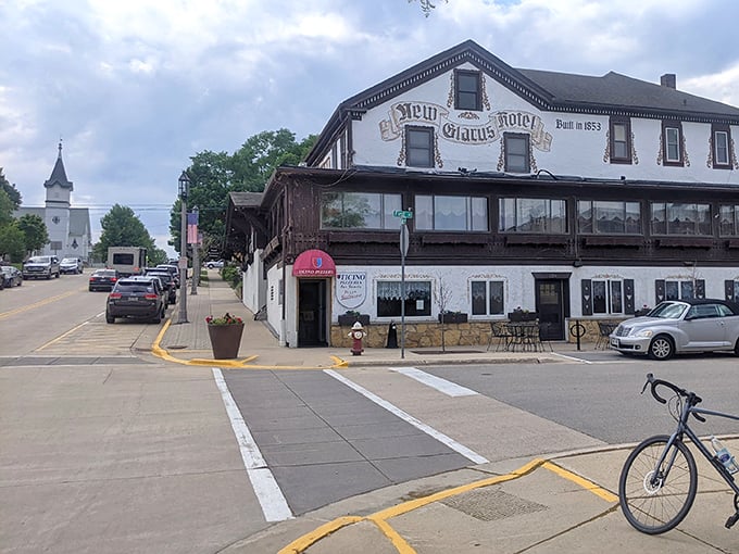 Swiss miss architecture! New Glarus Hotel stands like a European transplant that found its forever home in Wisconsin's rolling hills—that pizzeria proves cultural fusion tastes delicious.
