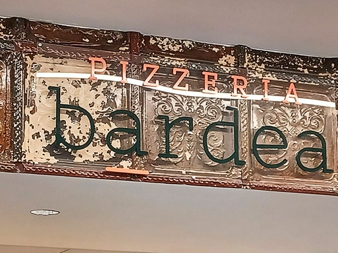 That ornate ceiling detail whispers "authentic Italian" louder than any neon sign ever could.