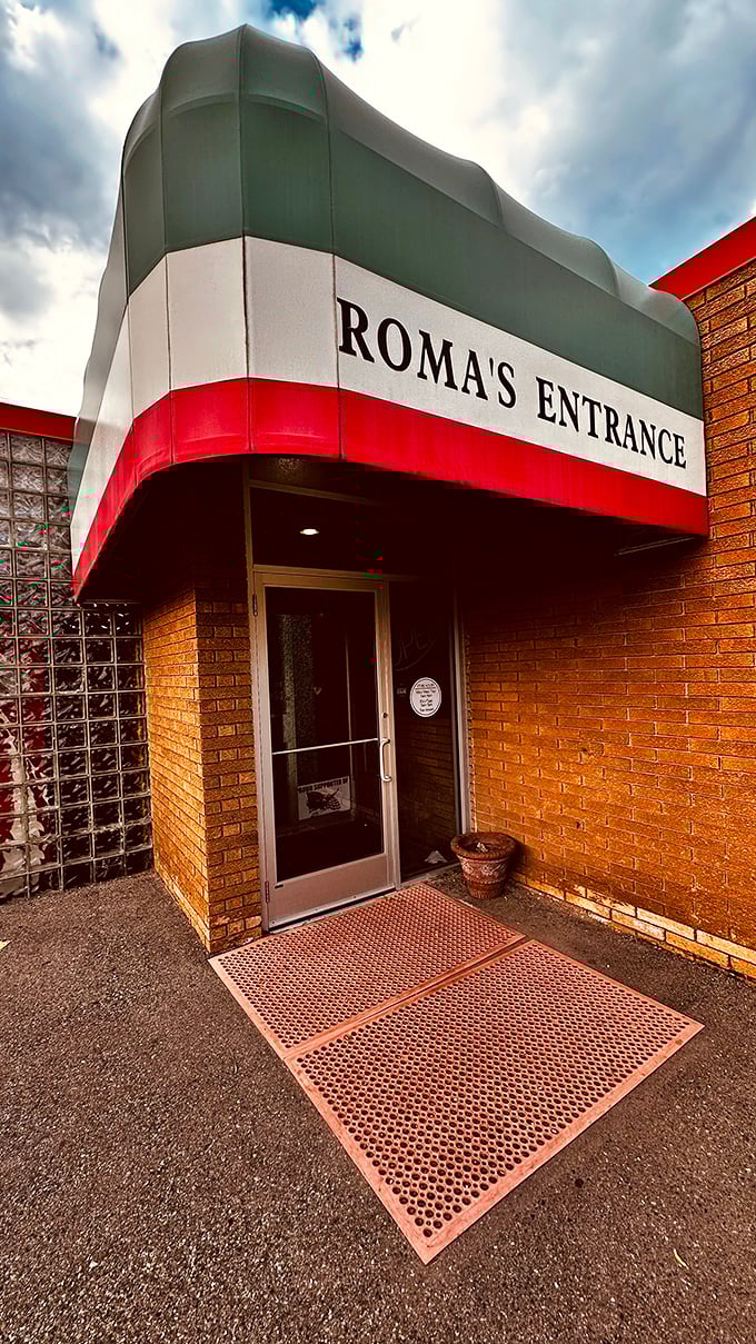 Roma's entrance proudly wears Italy's colors – a promise of authentic flavors waiting inside.