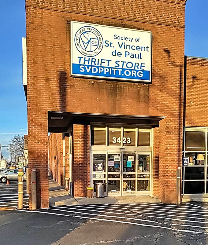 Brick buildings and blue signs create the perfect combination for serious thrift store adventures.