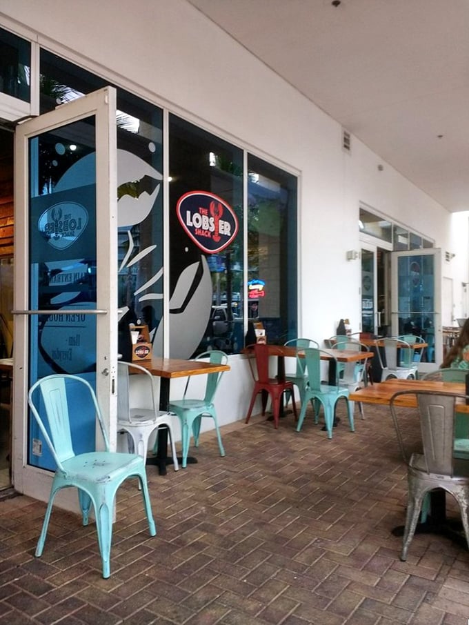 Miami Beach glamour takes a delicious detour at this unassuming spot. Those turquoise chairs aren't just pretty—they're front-row seats to flavor town.