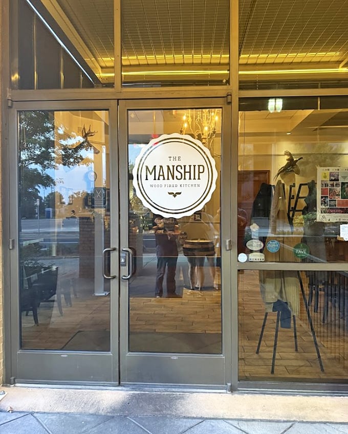 The Manship's sleek glass facade hints at the wood-fired artistry happening in those modern kitchens.