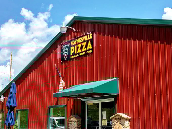 The little red pizza barn! Waynesville Pizza Company's rustic charm stands out like a delicious mirage for hungry mountain travelers.