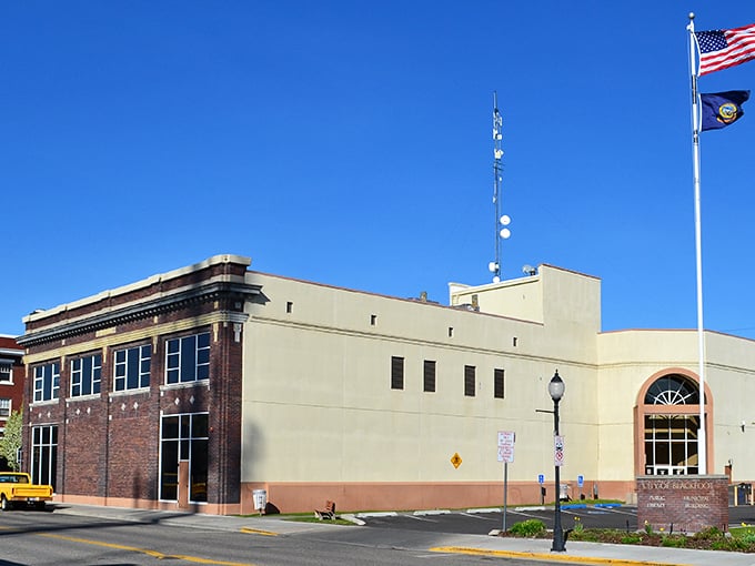 Blackfoot's city buildings stand under clear blue Idaho skies, representing the small-town governance that helps keep local prices surprisingly affordable.