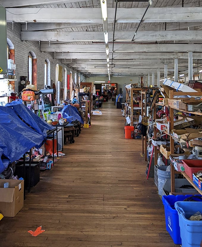 Wooden floors and tall windows create the perfect treasure-hunting atmosphere inside this beautifully repurposed industrial building turned shopping destination.