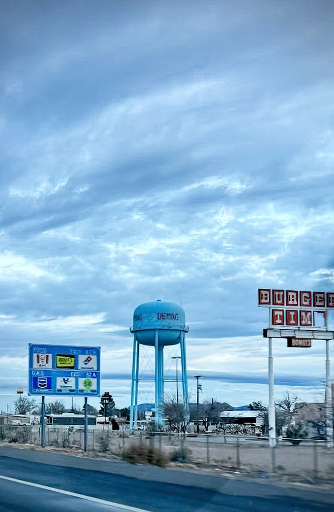 Deming's water tower stands like a desert lighthouse, guiding travelers to this hidden gem of affordable living.