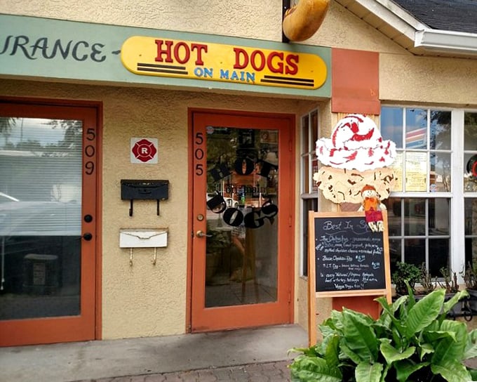 Hot Dogs on Main's charming yellow building houses some seriously creative frank creations – that ice cream cone sign is just a bonus!