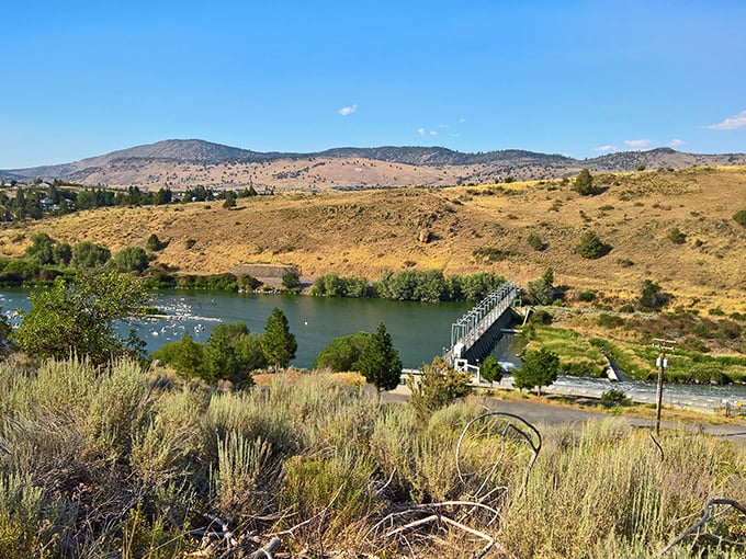 The road along Upper Klamath Lake offers breathtaking water views with mountains rising dramatically in the distance.
