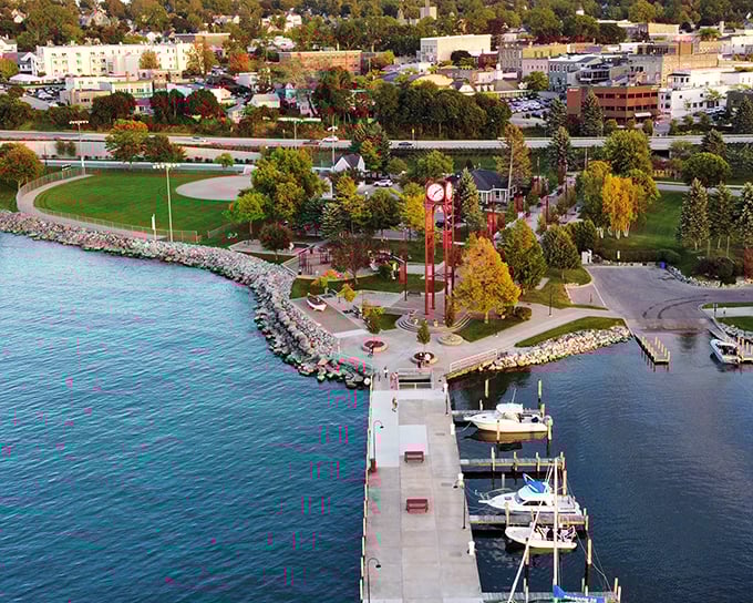 This lakefront park stretches like nature's own welcome mat, complete with a lighthouse that's been giving directions longer than most GPS systems.