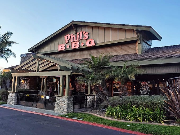 Phil’s BBQ glows under the California sky, where palm trees, friendly vibes, and smoky aromas promise a true San Diego feast.