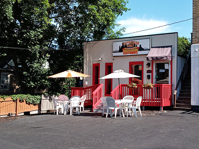 Outdoor seating under umbrellas transforms a quick bite into a proper dining experience worth savoring.