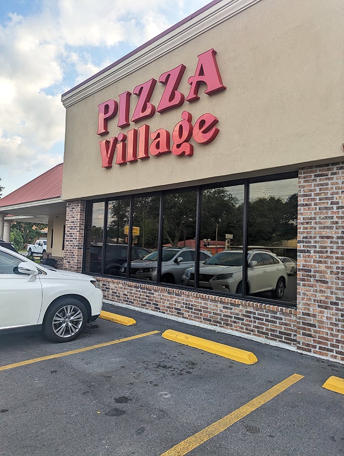 Behind those simple windows at Pizza Village lies a world where cheese stretches for miles and memories are made one slice at a time.