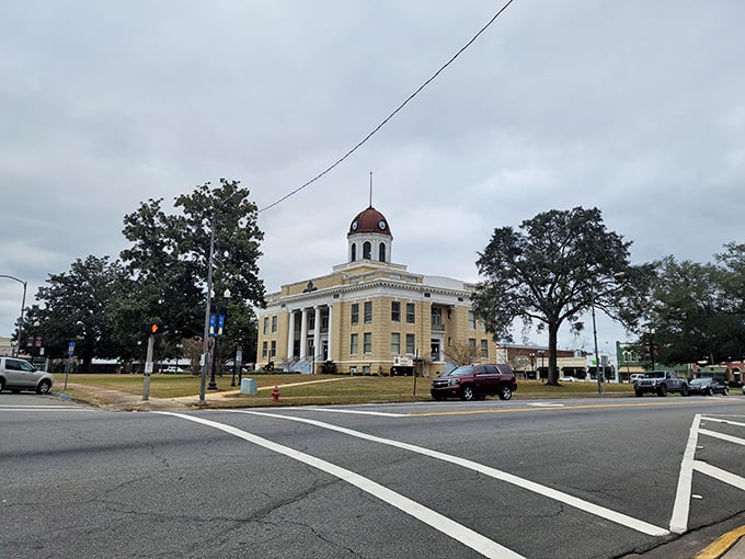 Classic Southern courthouse architecture surrounded by ancient oaks that have witnessed generations of small-town life and stories.