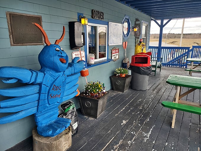 That blue lobster mascot stands guard outside Ray's – a whimsical sentinel protecting serious seafood within.