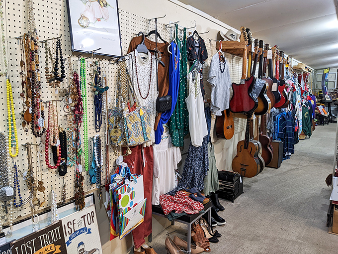 Guitars hanging next to vintage clothes prove one truth—you never know what you'll find, and that's exactly the point.