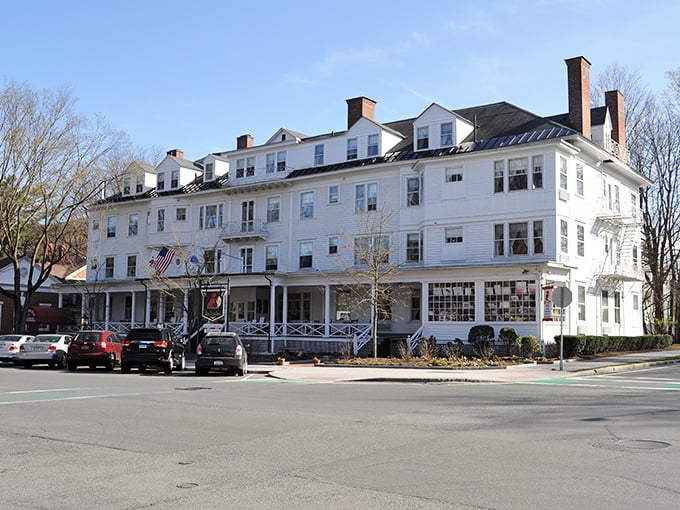 The Red Lion Inn's wraparound porch invites you to sit, sip, and watch small-town life unfold perfectly.