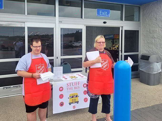 Those red aprons represent more than just helpful staff—they symbolize a century of community service.