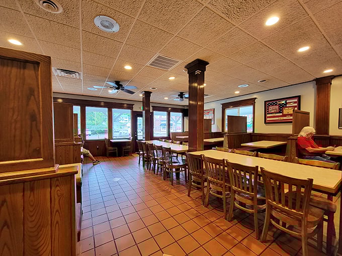 Wood paneling and American flags create the perfect backdrop for multigenerational family pizza nights together.