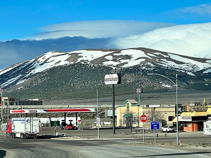 Snow-capped peaks frame Wells, Nevada, where roadside diners, friendly stops, and open skies make every drive feel refreshing.