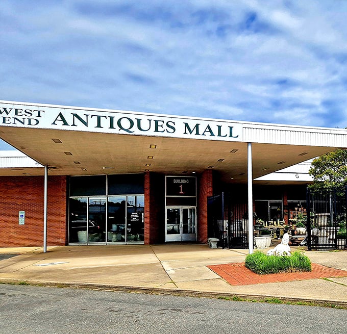 The classic brick façade of West End Antiques Mall stands sentinel over decades of collectibles. History waits inside those doors.