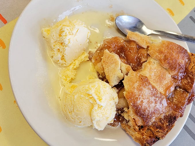 This isn't just apple pie—it's the reason ice cream was invented. A perfect marriage of flaky crust and cinnamon-kissed apples that demands a cold companion.