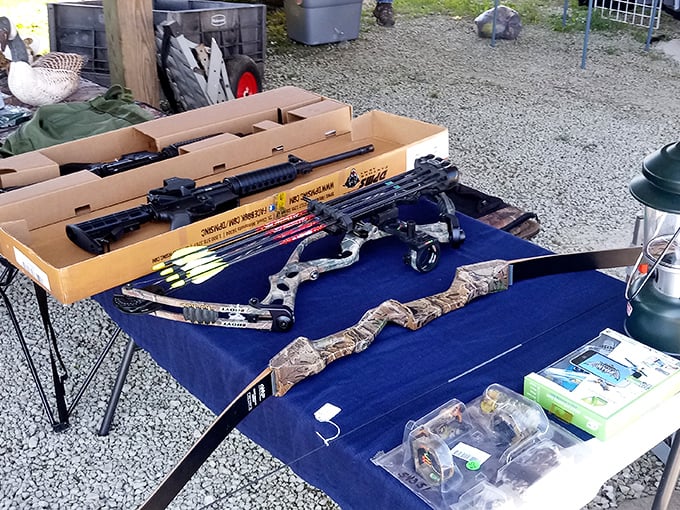 Archery equipment laid out on patriotic fabric—because nothing says weekend warrior quite like a compound bow purchase.
