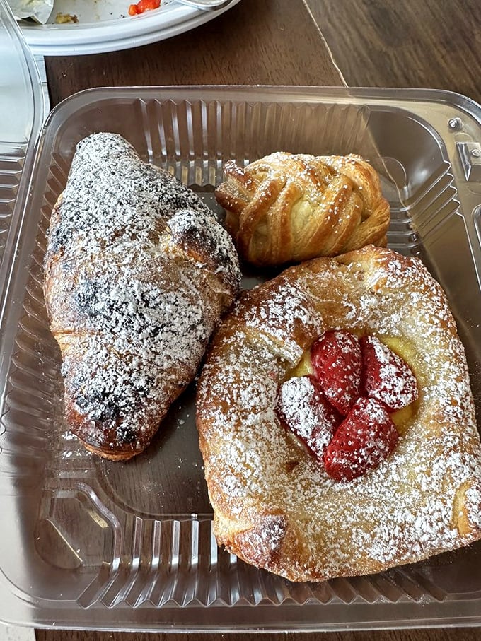 These pastries aren't just desserts—they're edible art, dusted with powdered sugar like a light Florida frost on a January morning.