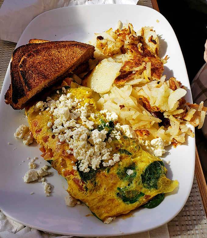This isn't just an omelet—it's a Greek vacation folded into fluffy eggs, where feta cheese and vegetables create a Mediterranean masterpiece.