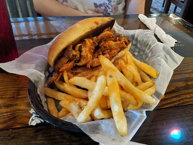 This pulled pork sandwich isn't messing around—piled high with tender, smoke-kissed meat and paired with hand-cut fries that could steal the show themselves.