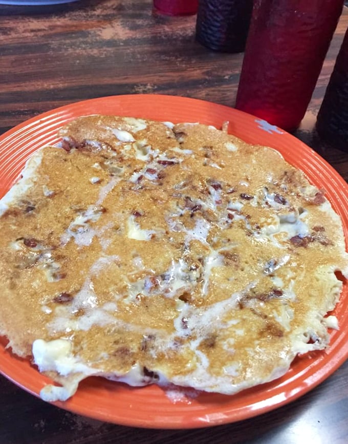 This isn't just any pancake—it's a bacon-studded masterpiece that answers the eternal question: "Why choose between sweet and savory when you can have both?"