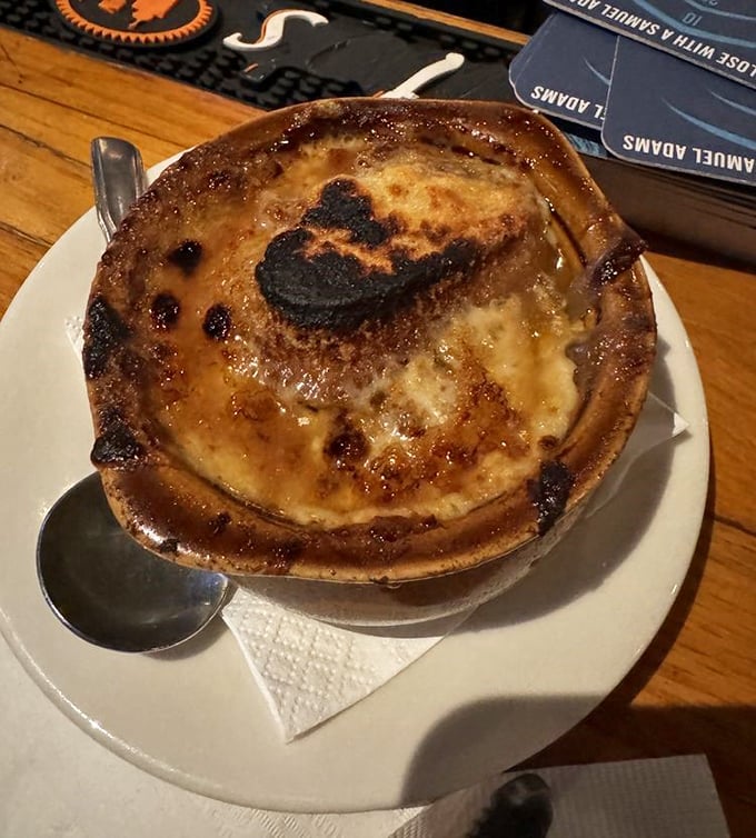 French onion soup with that glorious cheese blanket that stretches like a delicious culinary magic trick.