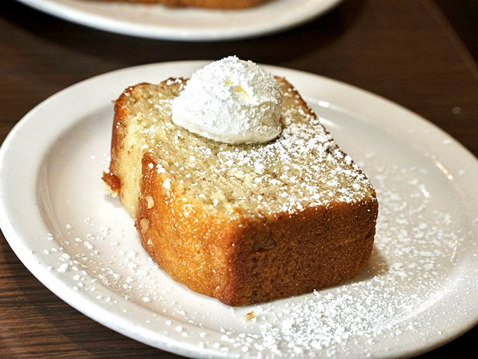This banana loaf, dusted with powdered sugar and topped with whipped cream, is what breakfast dessert dreams are made of.