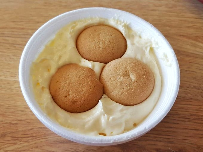 Banana pudding with vanilla wafers standing at attention – the kind of comfort food that makes you want to hug whoever made it.