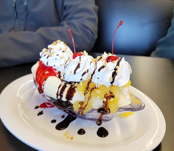 Dessert or art installation? This banana split arrives with such joyful abundance that nearby diners experience immediate menu regret and banana-based FOMO.