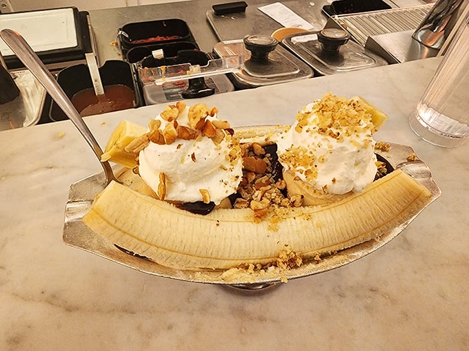 The banana split—America's dessert democracy in action. Whipped cream peaks, chocolate rivers, and banana valleys create a landscape worth exploring spoonful by spoonful.