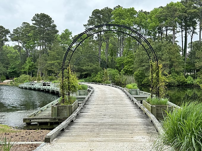 This arched walkway over calm waters feels like stepping into a storybook setting—one where rushing is strictly prohibited by local ordinance.