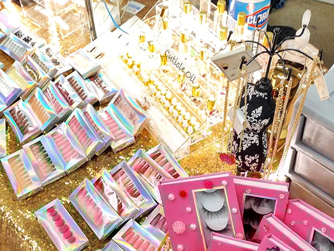 Beauty supplies arranged like a makeup artist's dream palette. False eyelashes and glitter for days—glamour at flea market prices!