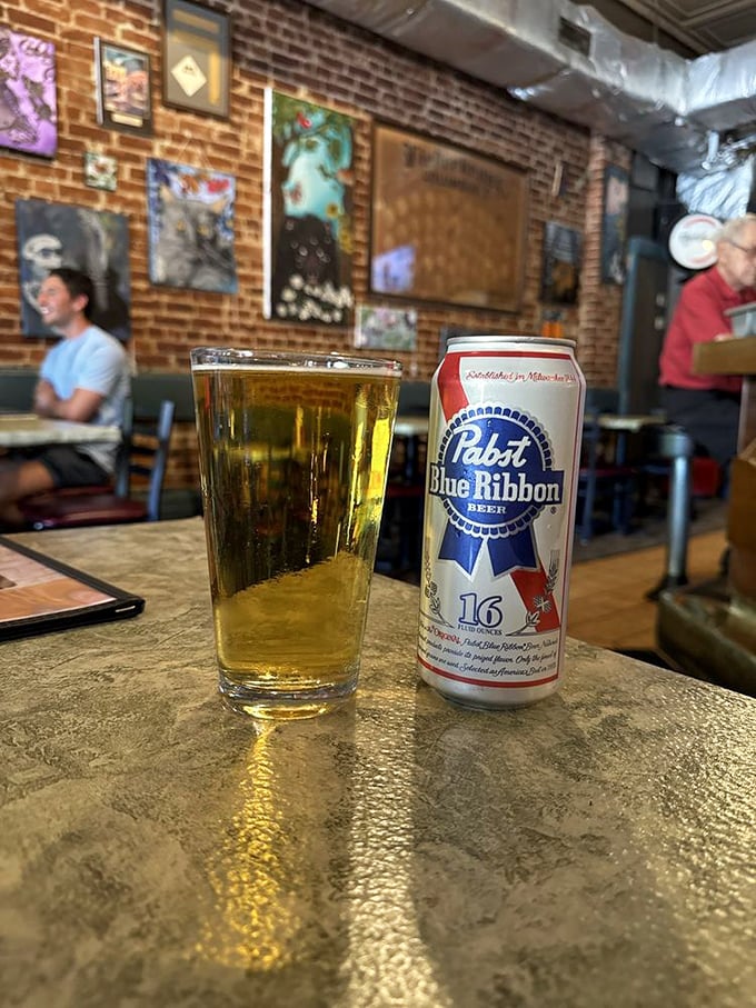 Nothing says "authentic neighborhood bar" quite like a cold PBR in a proper glass with the can standing by as proof of your good taste.
