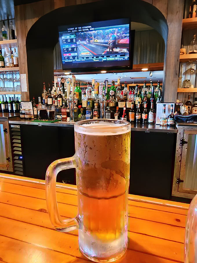 A frosty mug of beer stands at attention before the impressive bar – the perfect companion for your barbecue adventure.