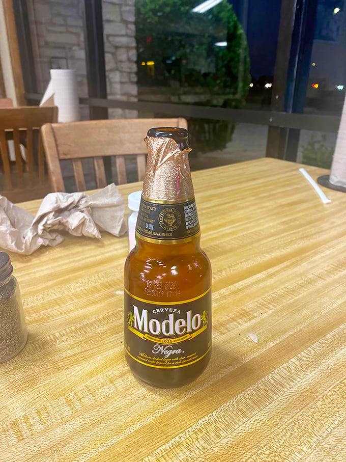 Nothing complements smoky barbecue quite like an ice-cold Modelo – it's like they were destined to meet on this wooden table.