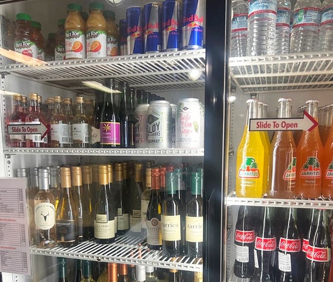The beverage cooler: where local wines meet classic sodas in peaceful coexistence. Choose your adventure – pinot noir or a Mexican Jarritos?