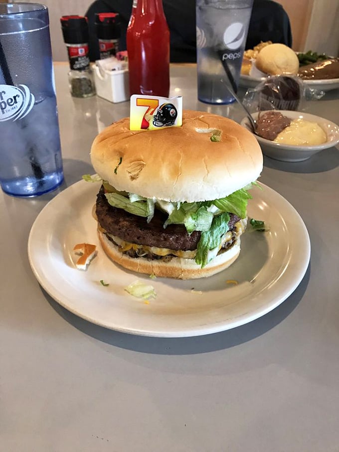 That little football helmet toothpick isn't just decoration—it's a victory flag celebrating a burger that deserves its own highlight reel.