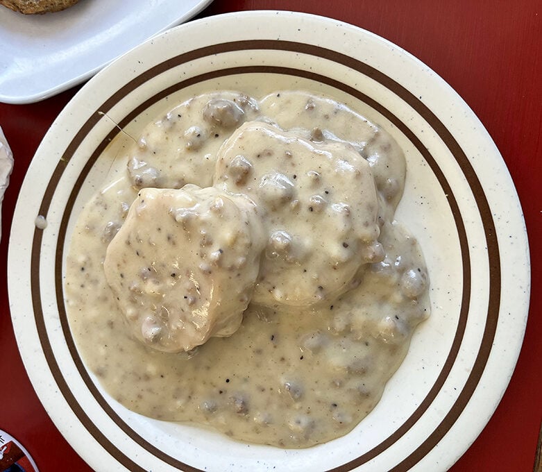 Biscuits and gravy—the ultimate Southern comfort food litmus test. Ruthy's version passes with flying, fluffy, gravy-soaked colors.